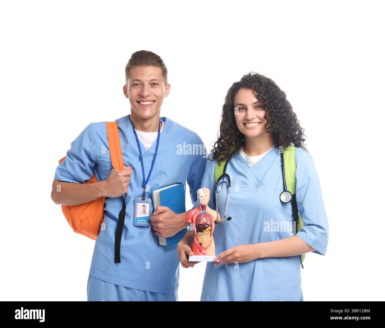 Medical students with human body model and book on white background ...