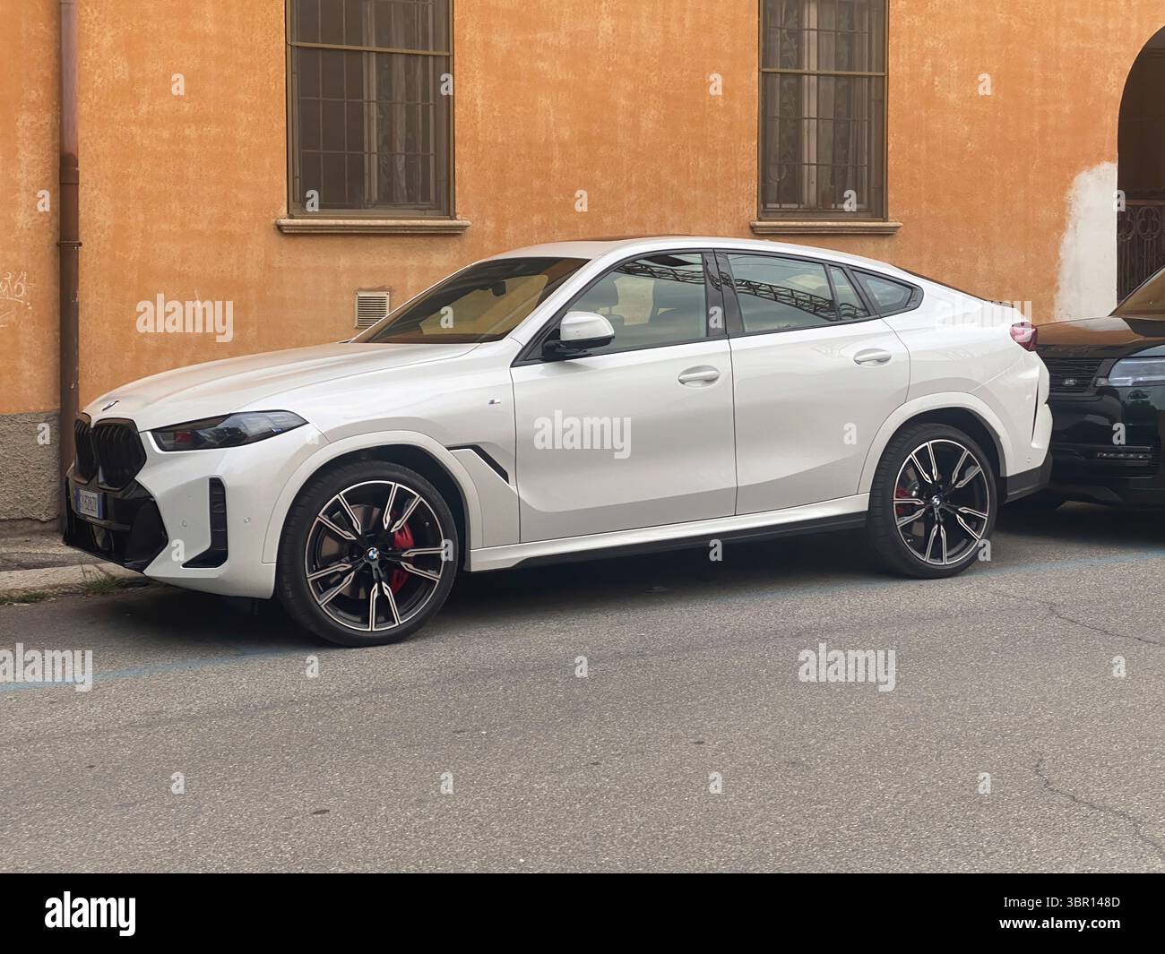 Cremona, Italy June 8th 2025 White BMW X6 M Competition with black and ...