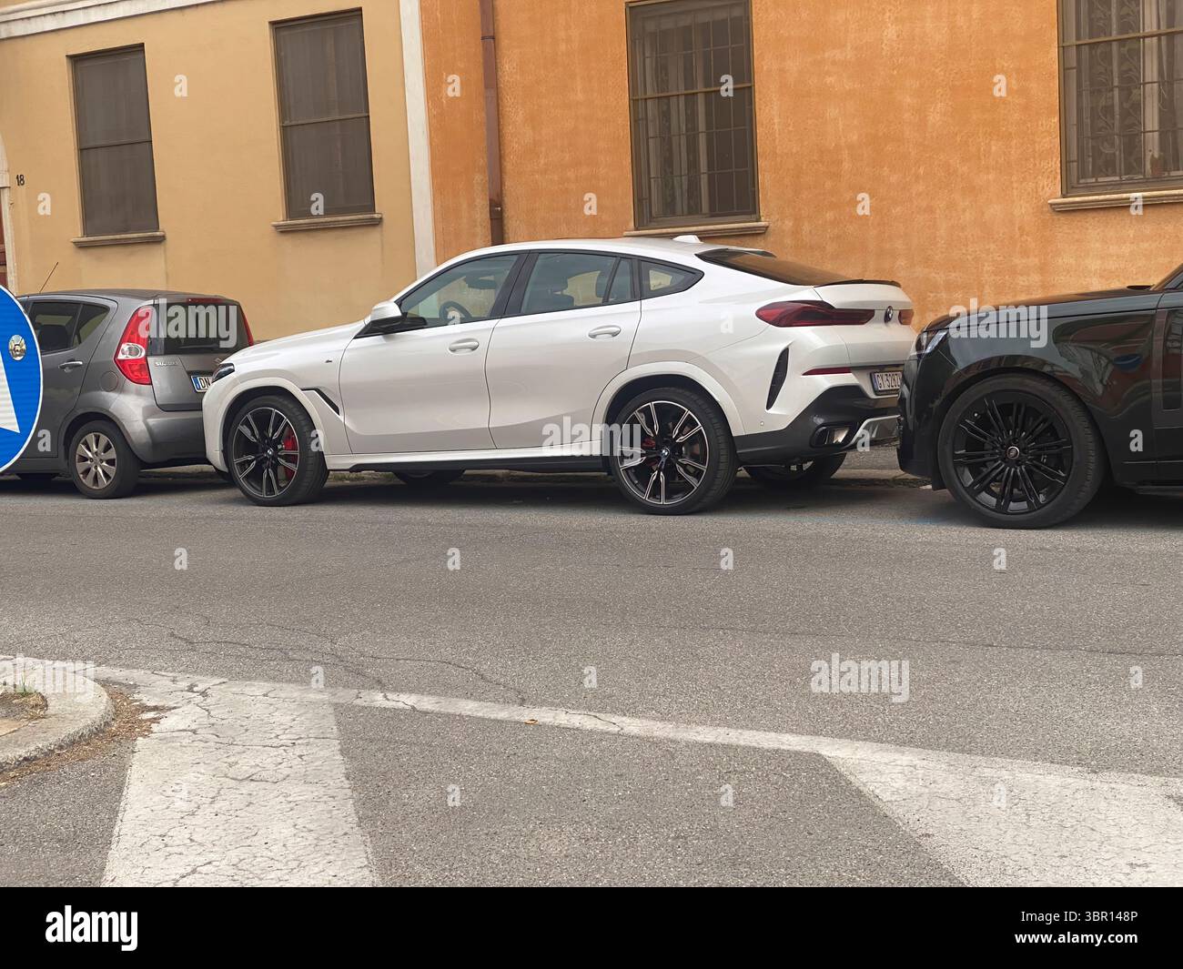 Cremona, Italy June 8th 2025 White BMW X6 M Competition with black and ...