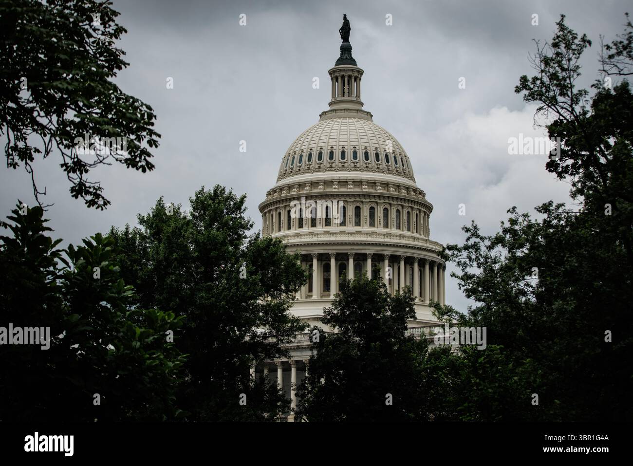 Storm clouds hang over the U.S. Capitol building on Capitol Hill on ...