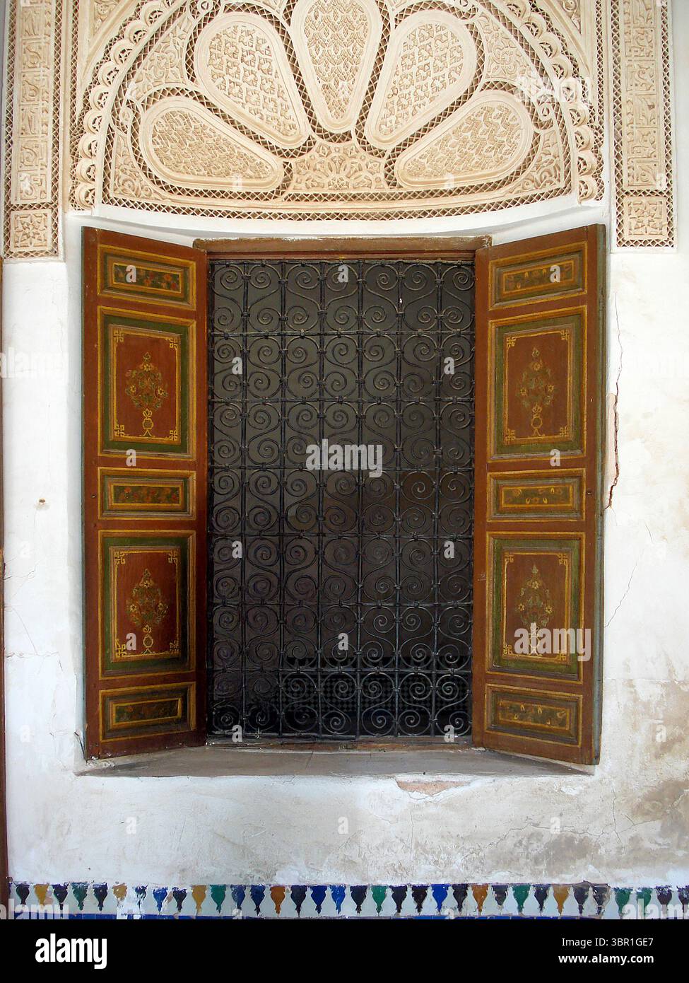 Traditional Moroccan window with painted wooden shutters and decorative ...