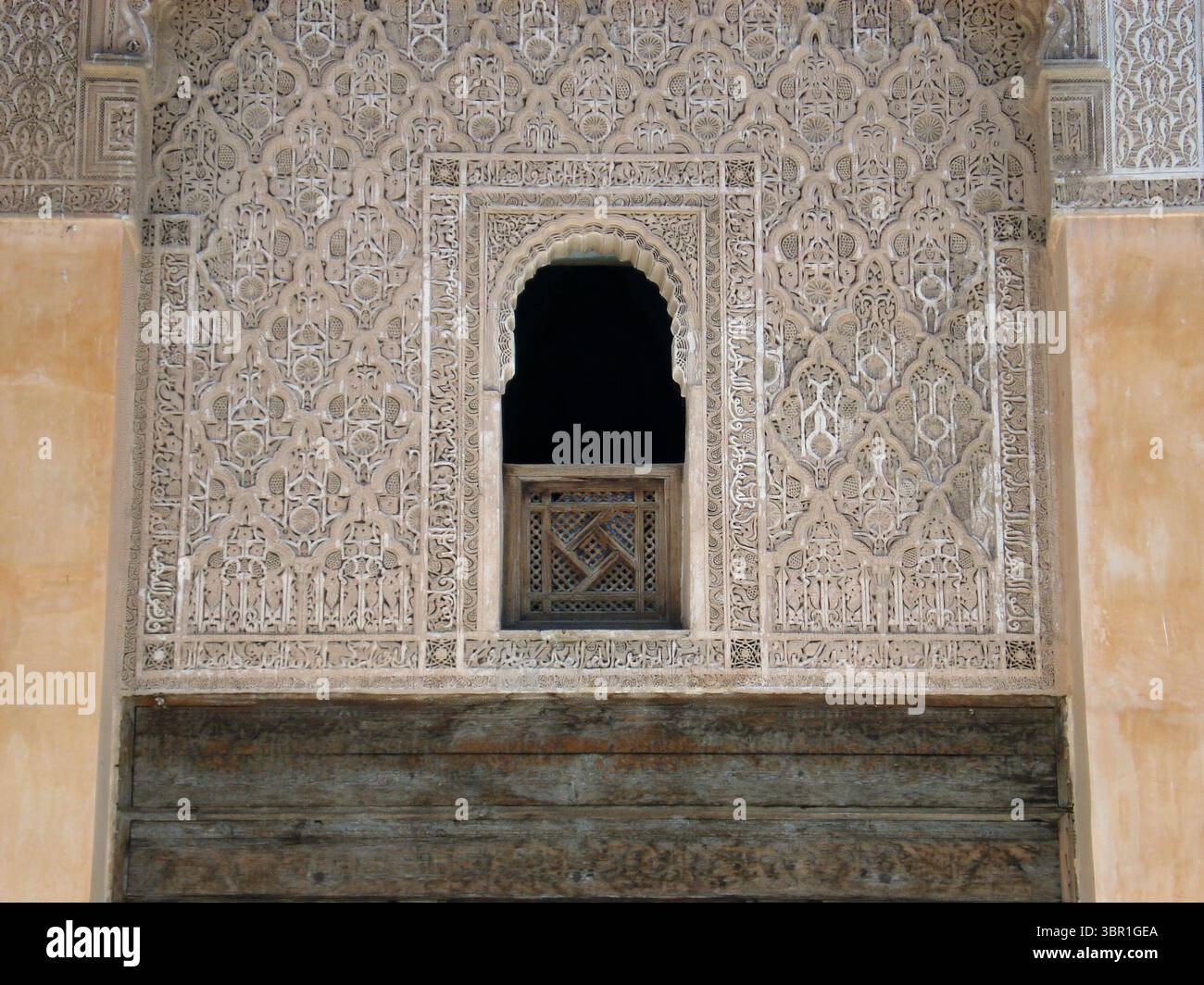 Close-up of a traditional Moroccan window framed by detailed carved ...