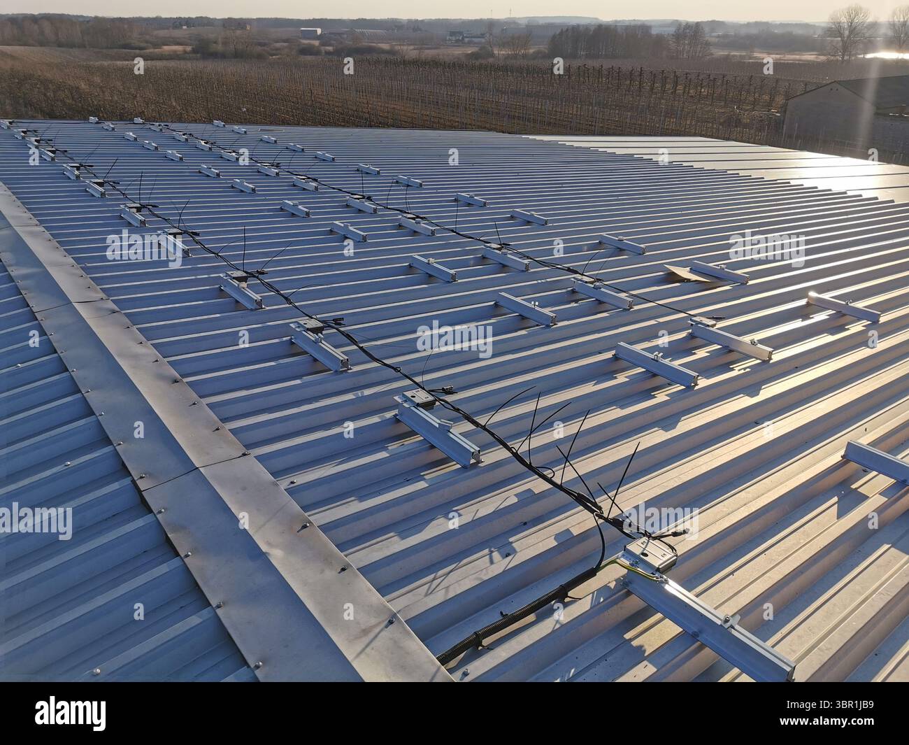 Structure on the house roof for solar panels with installed power optimizers Stock Photo - Alamy