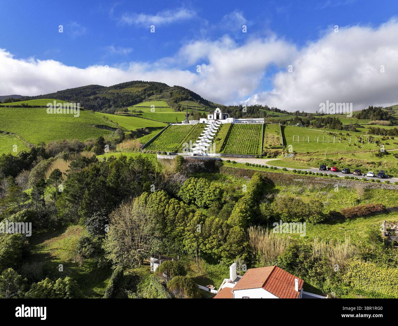 Aerial view of the stark white steps of the Santuario de Nossa Senhora da Paz cascading down ...