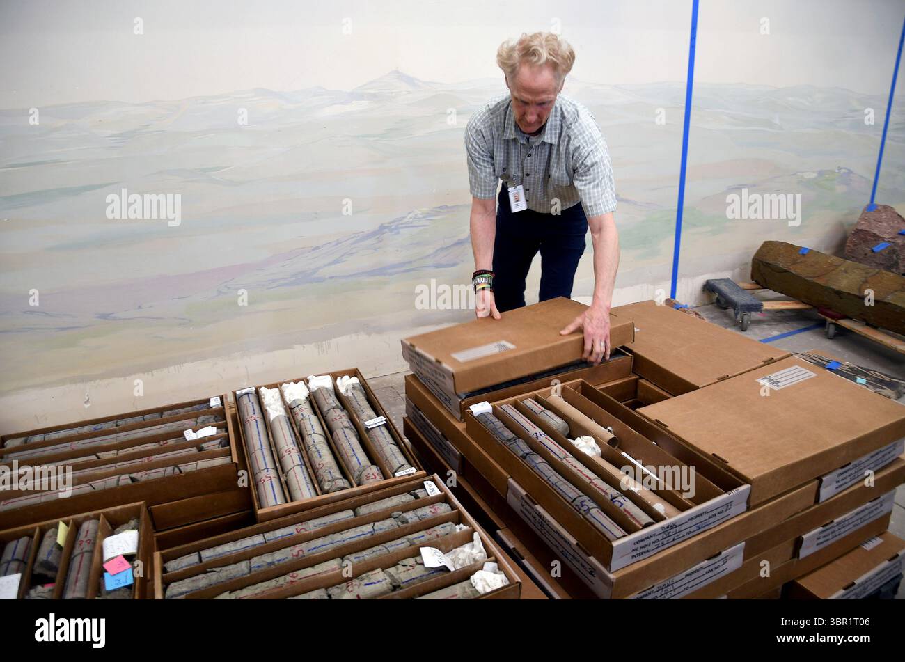 Geologist James Hagadorn closes boxes of core rock samples at the ...