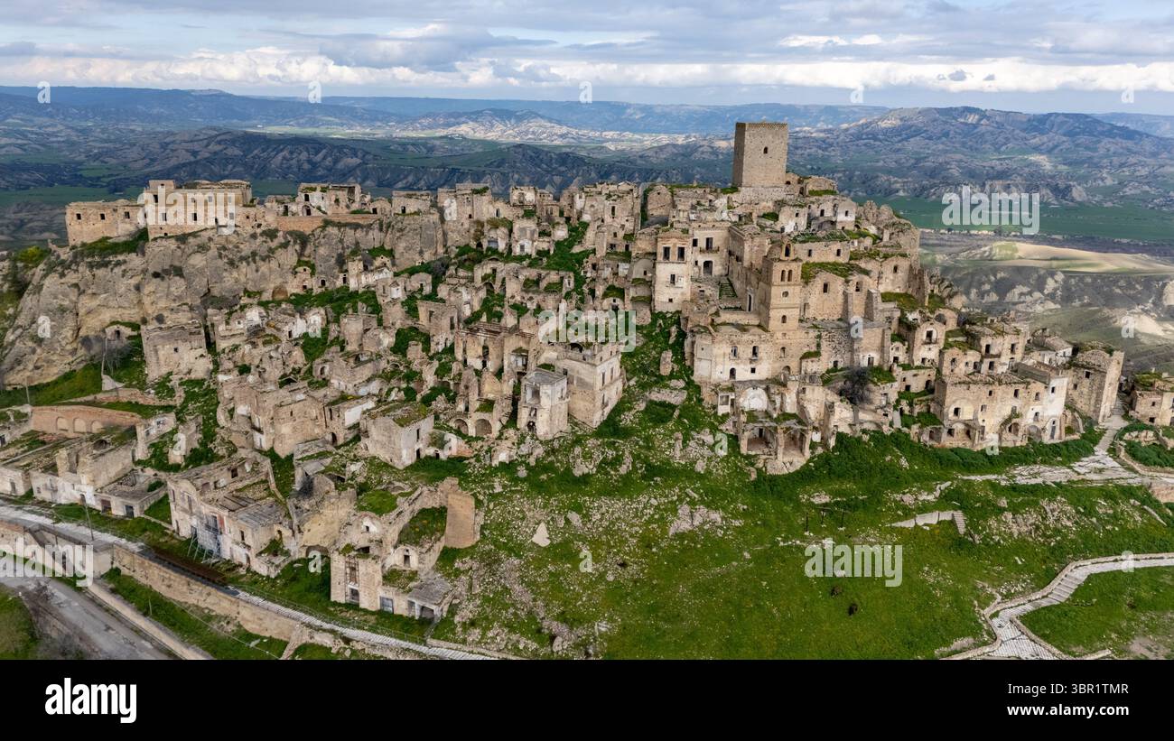 Aerial view of an ancient abandoned village of Craco, Italy with stone ...