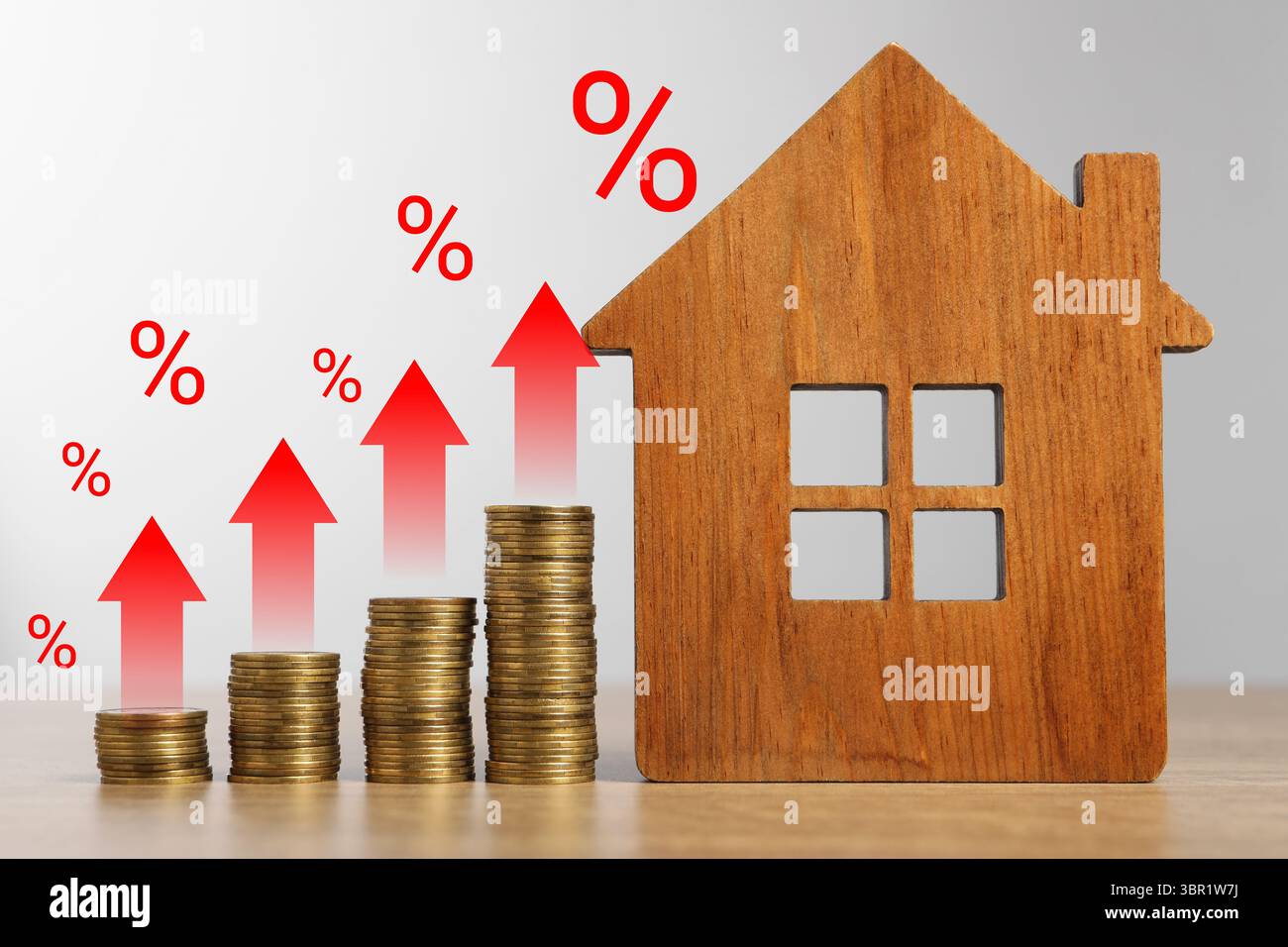 Increase in real estate value. House model and coins on table. Growing ...