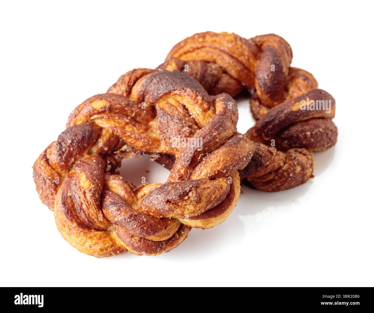 Homemade soft pretzels with cinnamon and sugar isolated on white ...
