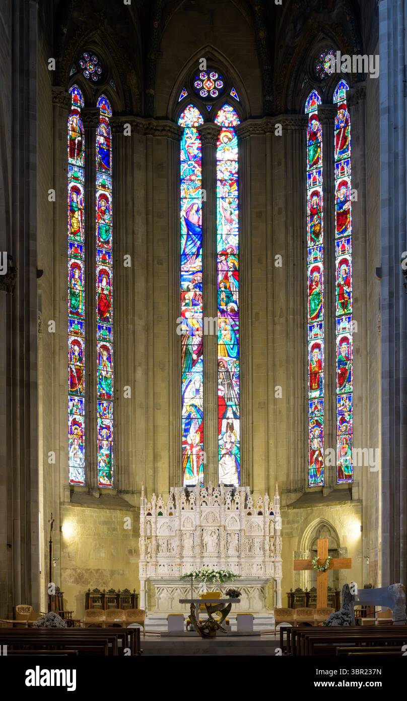 High altar of Arezzo Cathedral with marble Gothic reliefs and stained ...