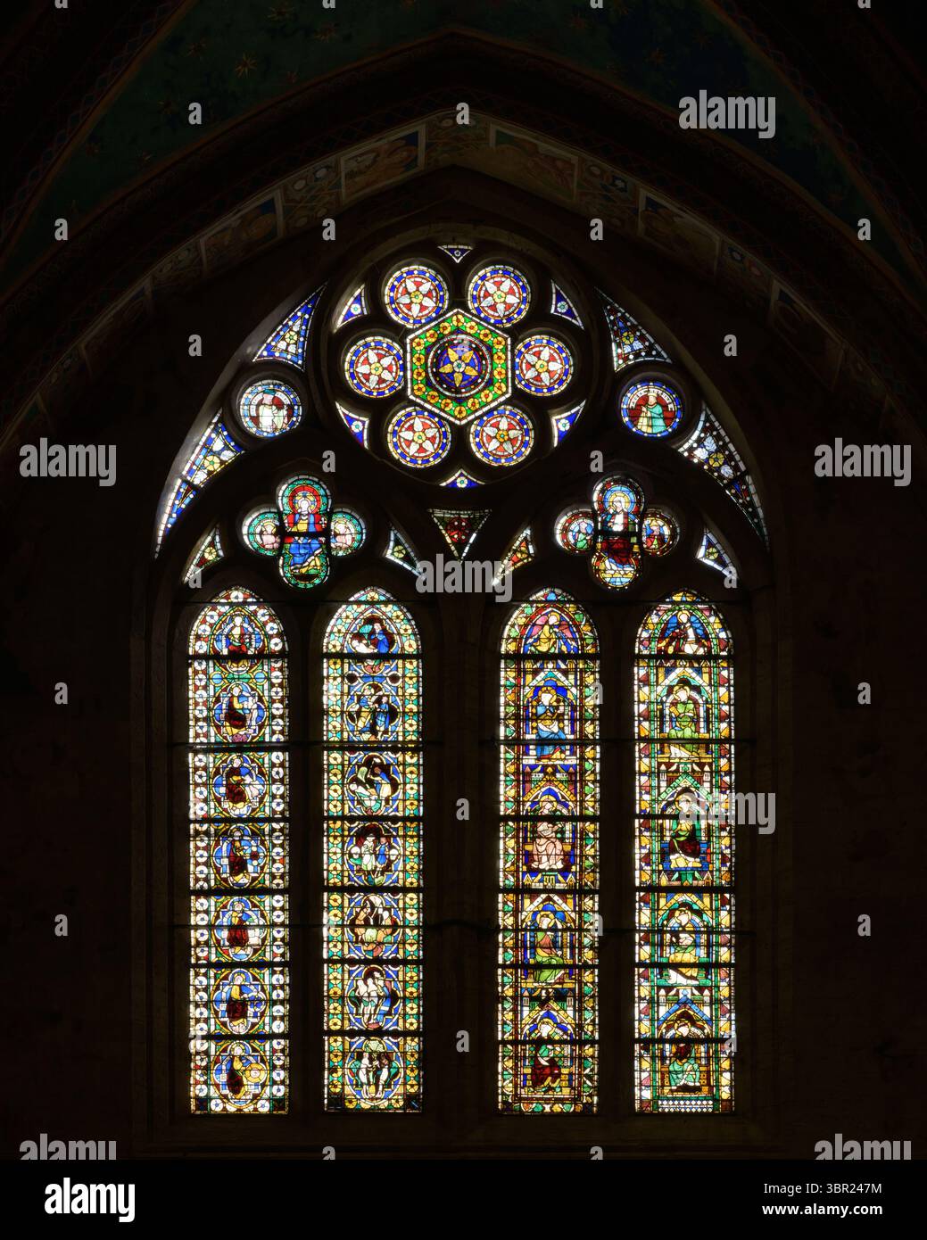 Gothic stained glass window in the transept of the Upper Church of San ...