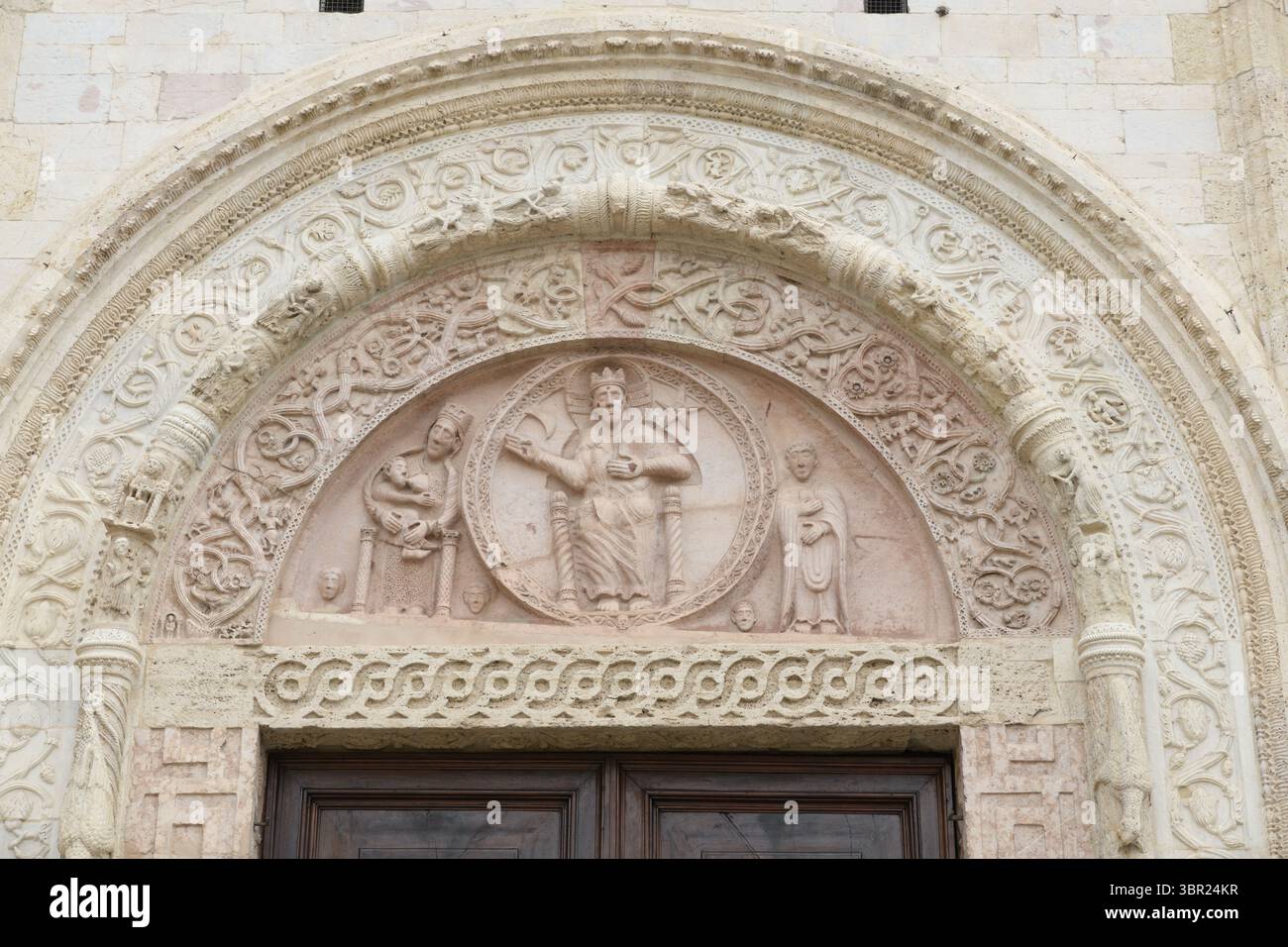Romanesque central portal tympanum with Christ in Majesty, Virgin Mary ...