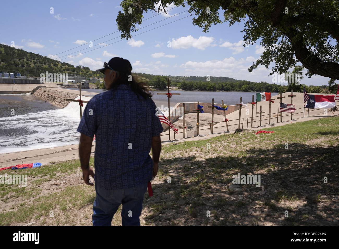 Martin Nevarez looks at the memorial crosses setting up along the ...