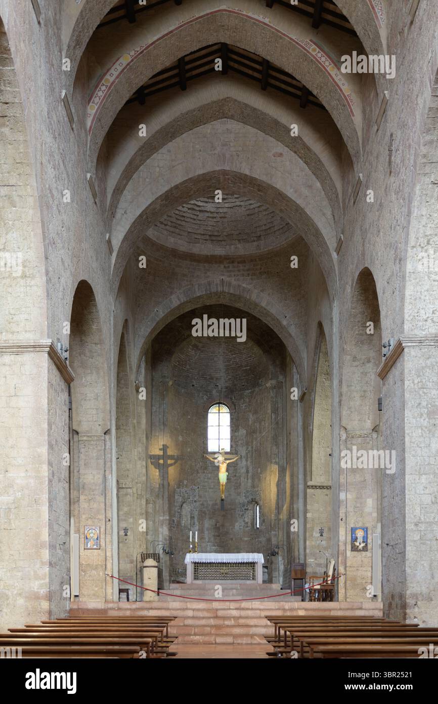 Interior of the Abbey of Saint Peter in Assisi, Umbria, Italy, with Romanesque stone arches ...