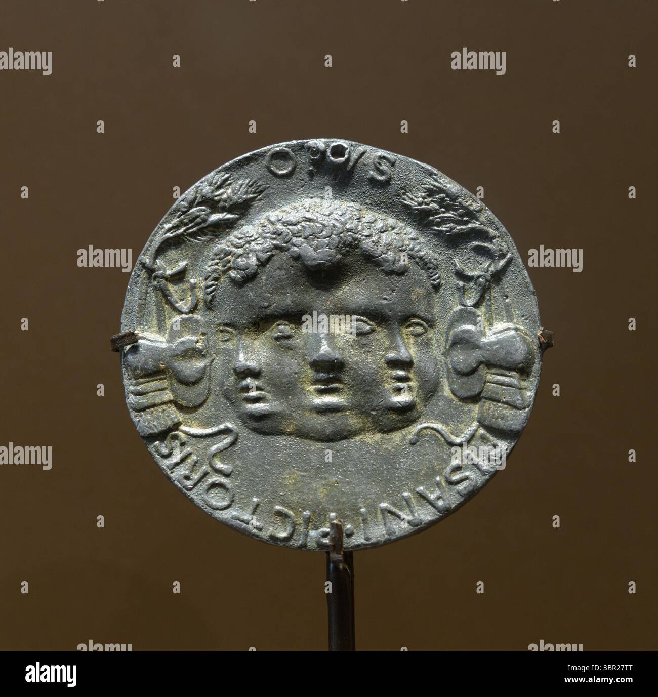 Allegorical reverse of bronze medal by Pisanello with triple-faced head ...