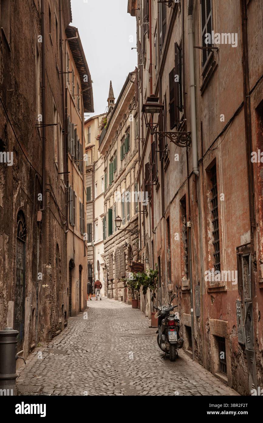 ROME, ITALY - JANUARY 15, 2025: A narrow cobblestone street in the old ...