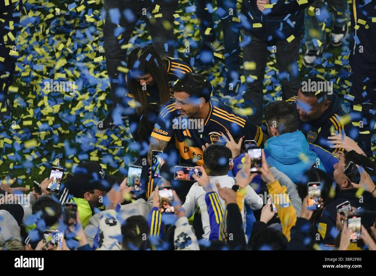 Leandro Paredes, center, and his wife Camila Galante greet fans as they ...