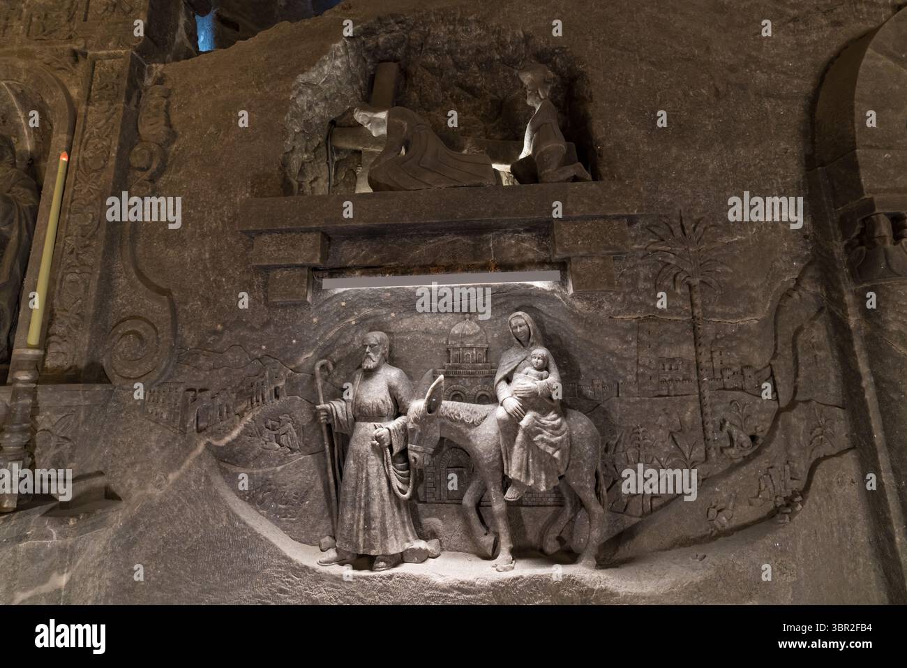 arved art work on rock salt wall in Wieliczka Salt Mine in Wieliczka ...