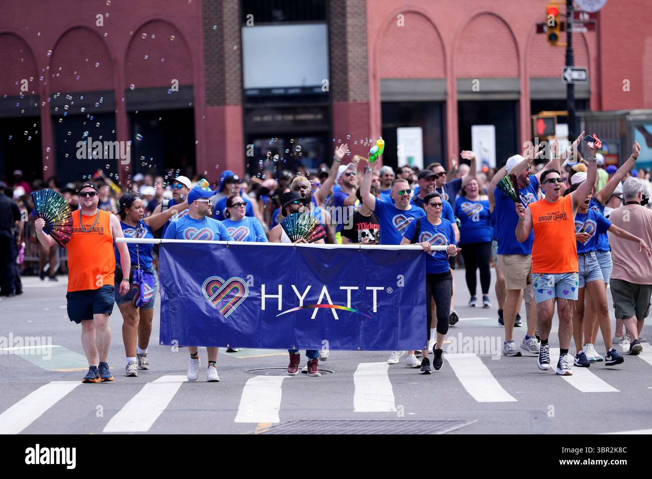 Parade-goers from Hyatt walk in the NYC Pride March on Sunday, June 29 ...