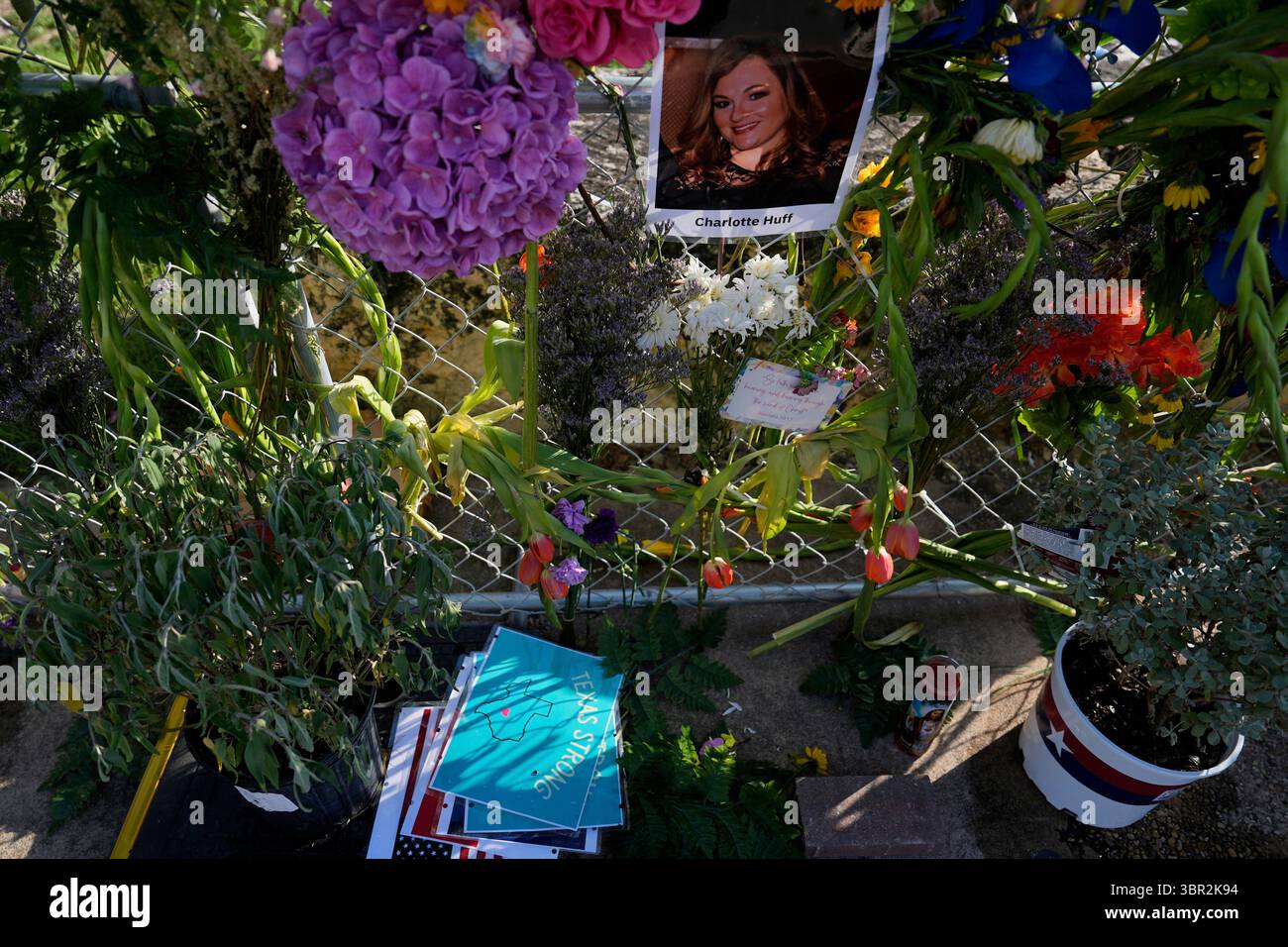 A picture of Charlotte Huff hangs at a memorial for flood victims on ...