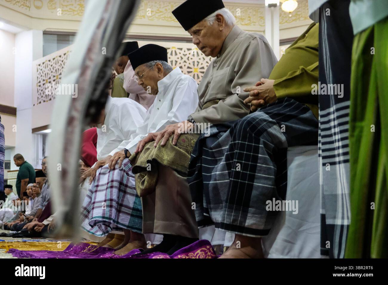 Tun Mahathir Mohamad seen with congregants performing the Maghrib ...