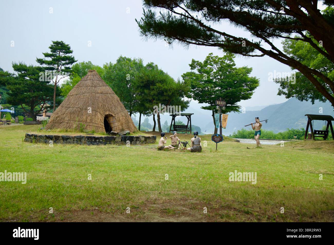 Gongju City, South Korea - June 13th 2025: Life-sized diorama of a prehistoric village scene at ...
