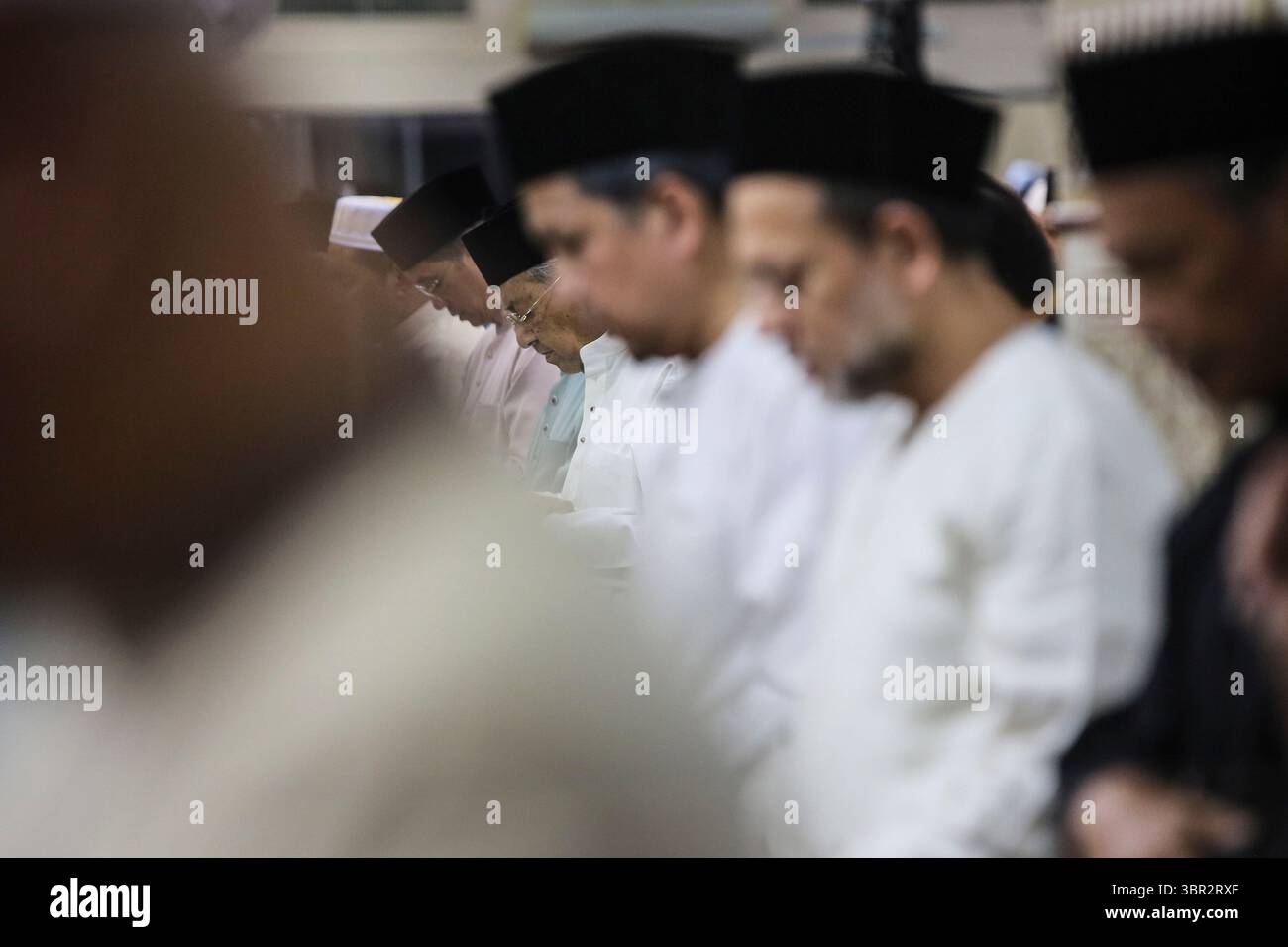 Tun Mahathir Mohamad seen with congregants performing the Maghrib ...