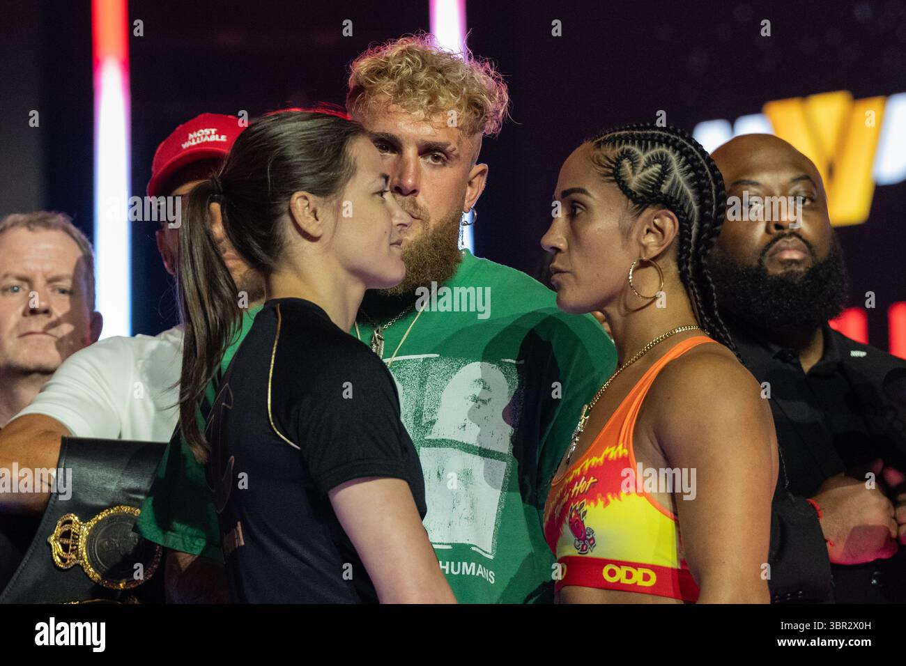 Katie Taylor and Amanda Serrano face off as Jake Paul stands with them ...