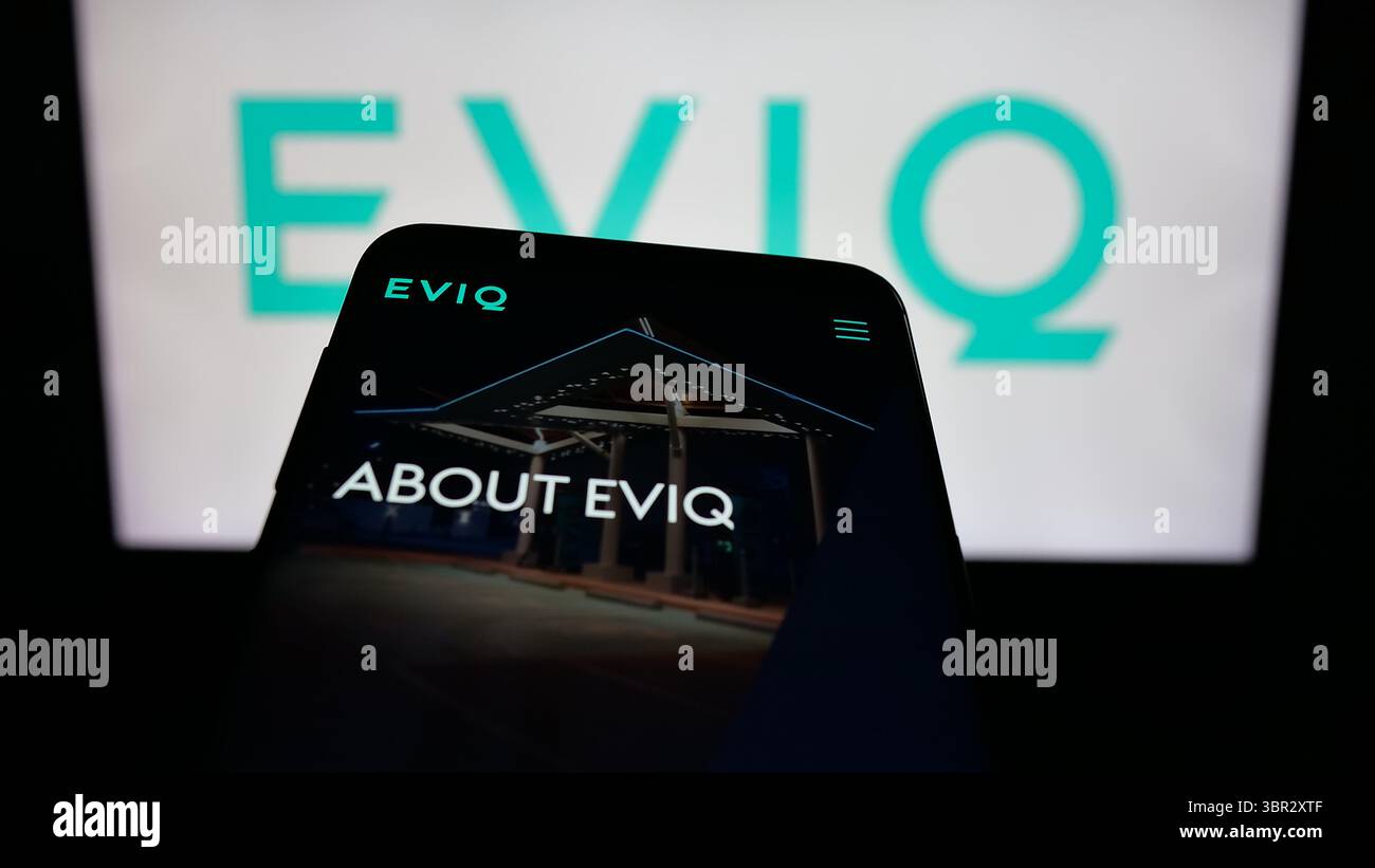 In this photo illustration, a mobile phone with the website of Electric ...