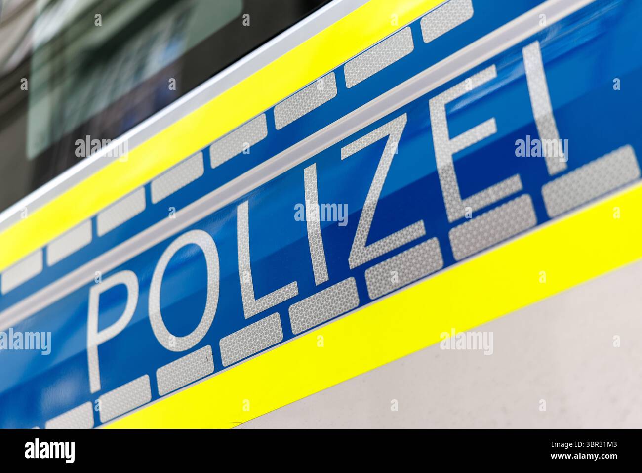 10 July 2025, Bavaria, Munich: The lettering "Polizei" can be seen on a ...