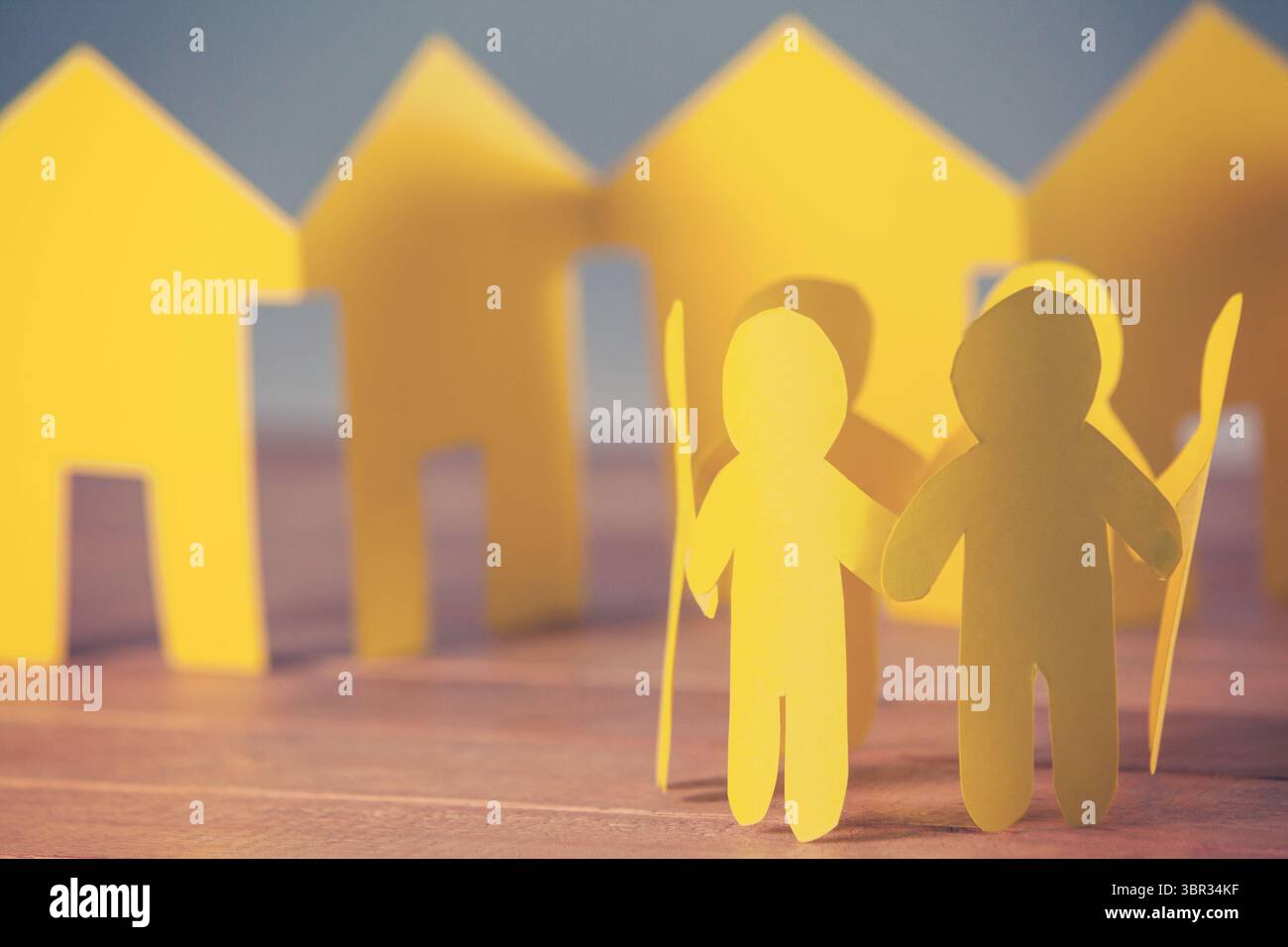 Paper chain people and houses hi-res stock photography and images - Alamy