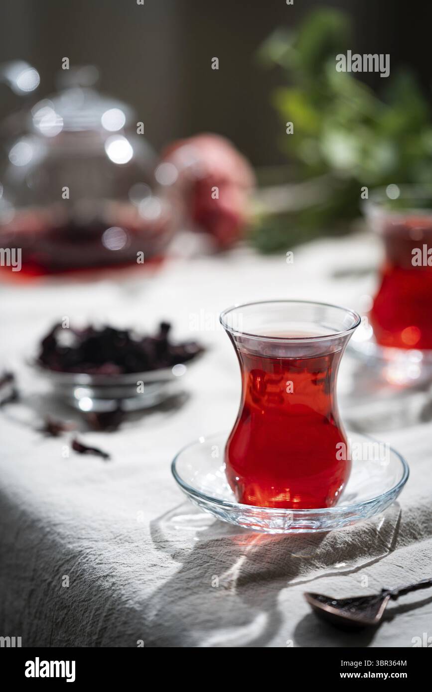 Hot red karkade tea in a glasses on rustic background Stock Photo - Alamy