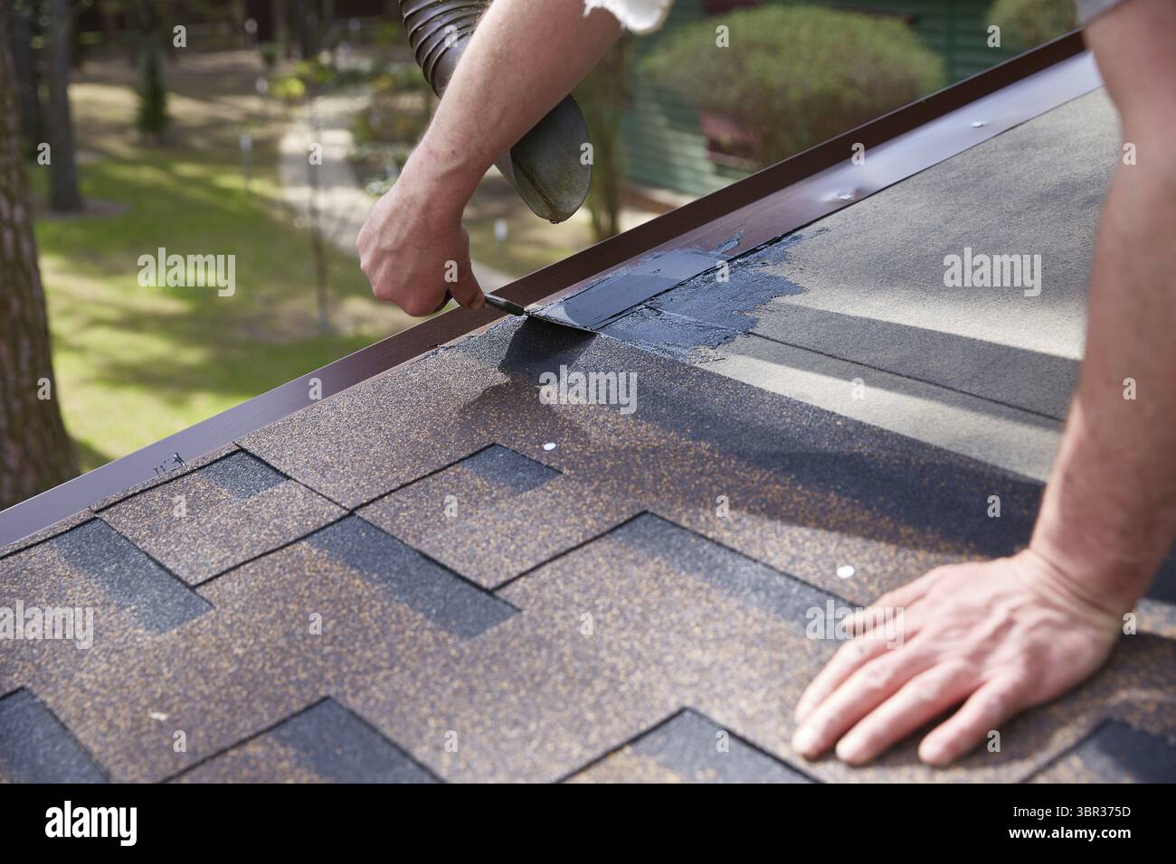 Worker's hands are smeared with waterproofing mastic for the roof Stock ...