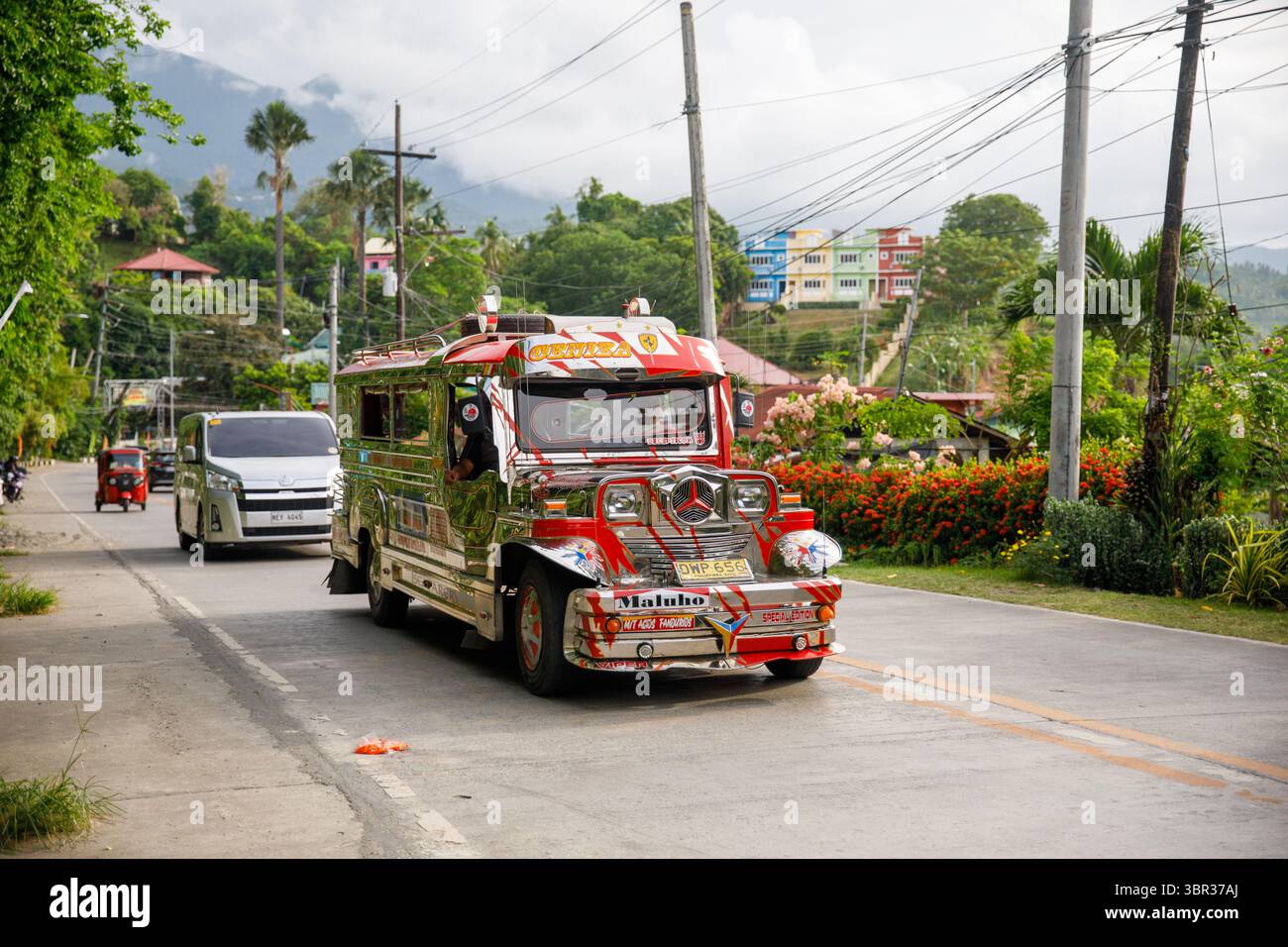 June 13, 2025: Jeepney and Tricycle on Busy Street in Puerto Galera ...