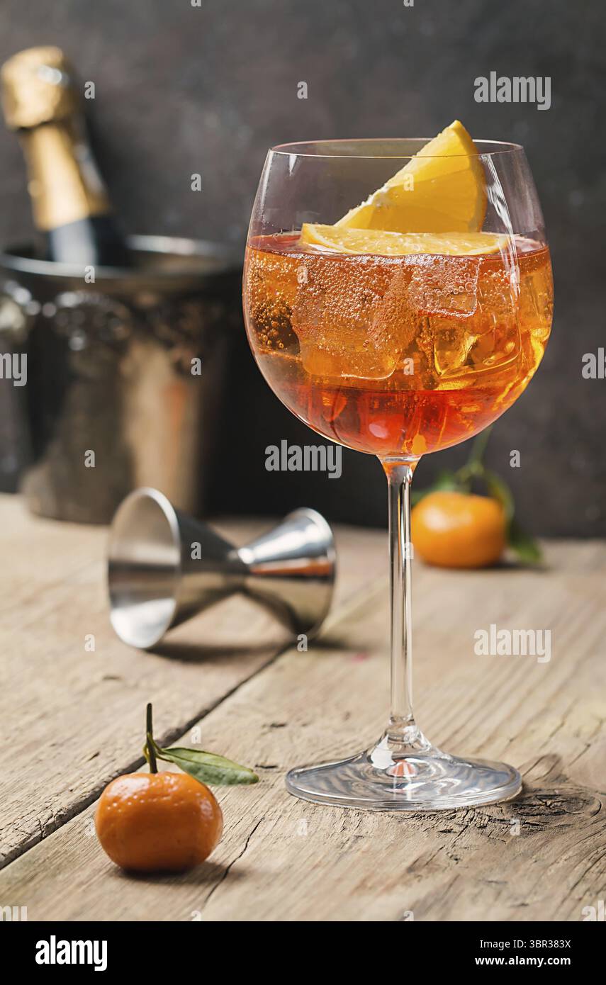Classic Italian Aperol spritz cocktail in glass on wooden table Stock ...