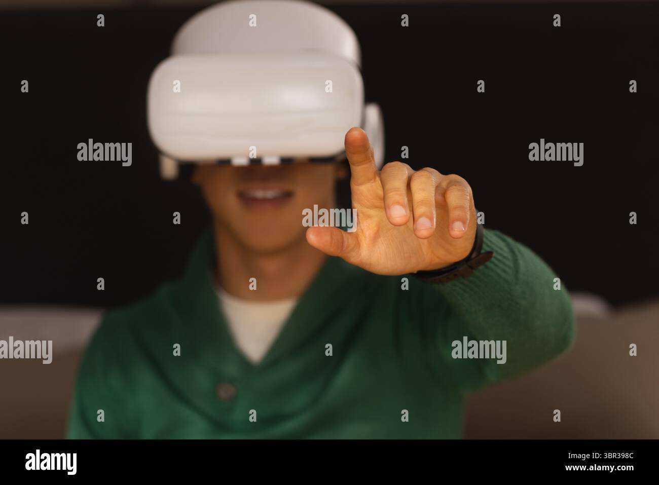 VR headset projecting holographic interface with hand reaching out on ...