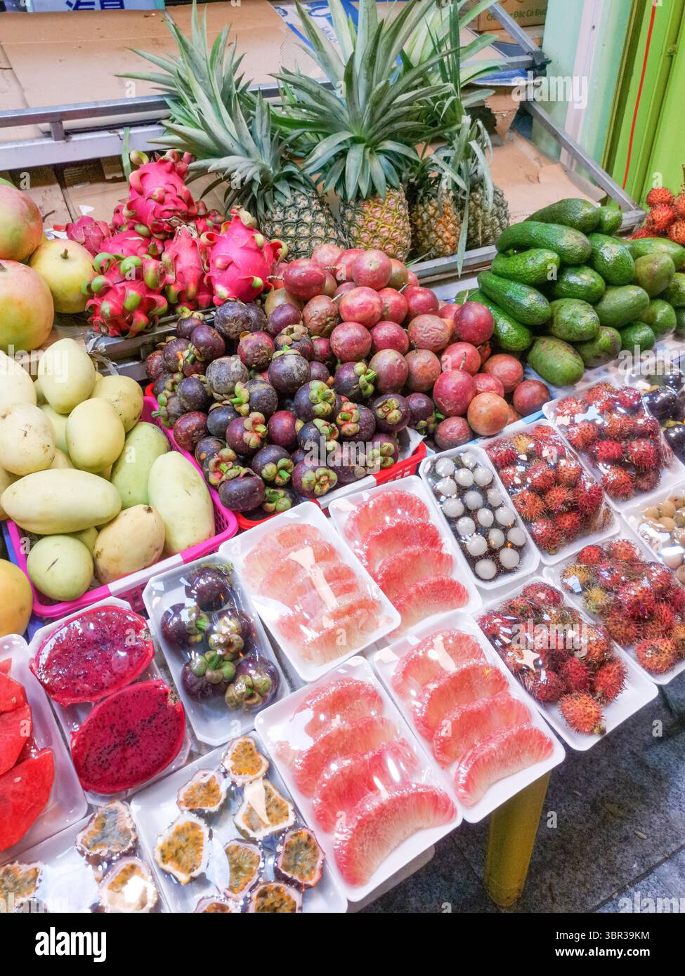 Fresh fruits in packing at market Stock Photo - Alamy