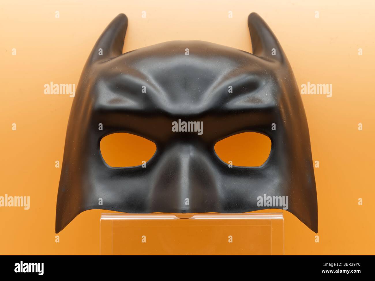The Batman mask by Ciao Srl isolated on orange background Stock Photo ...