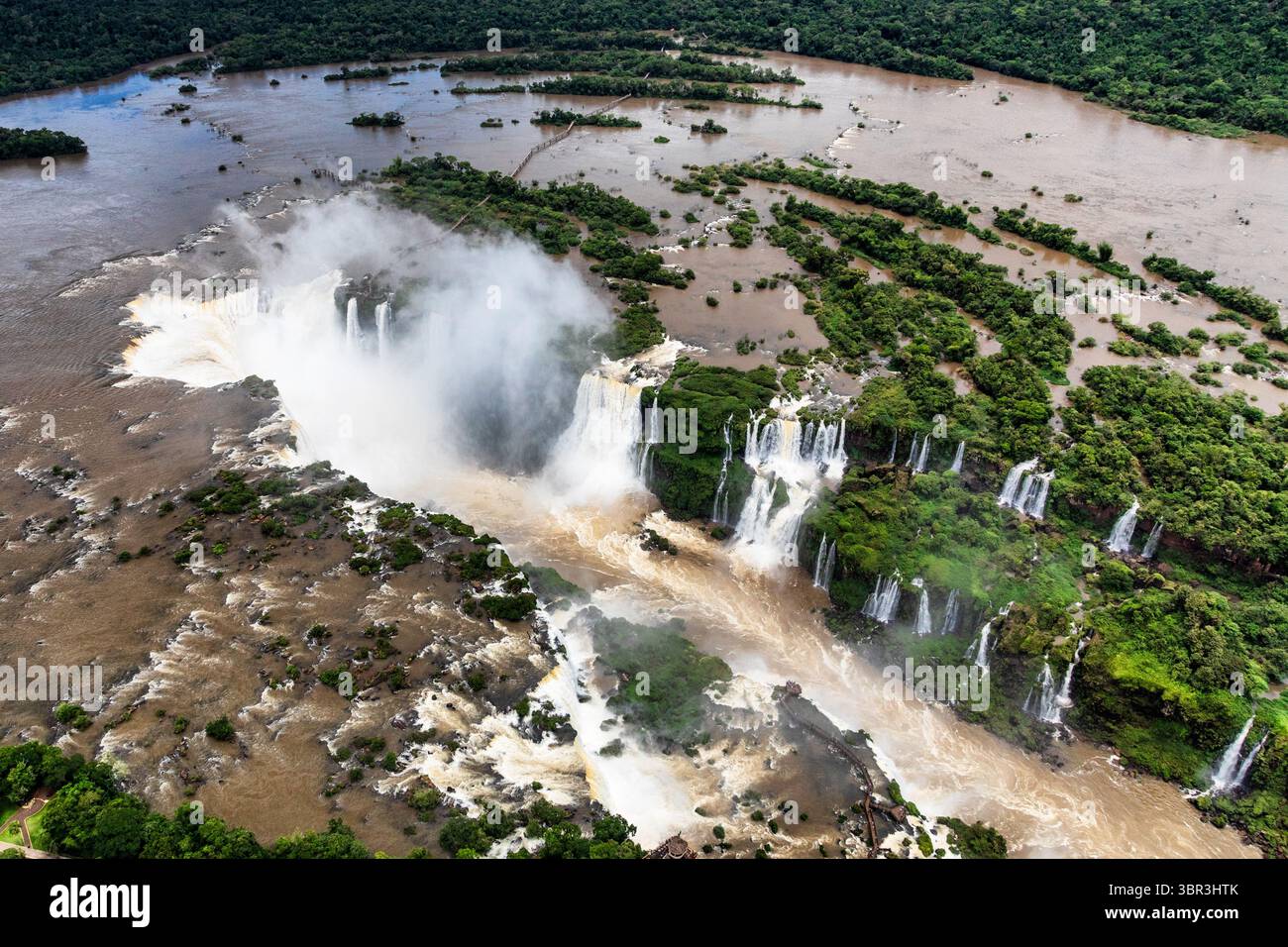 Aerial view of the majestic Iguazu Falls cascading with ferocious power ...