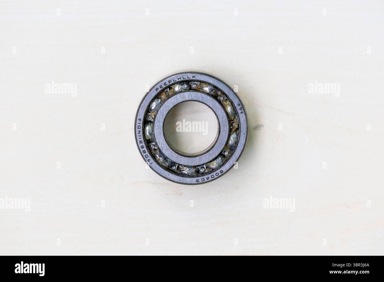 Old motorcycle bearing, top view, isolated on white background. Round ...