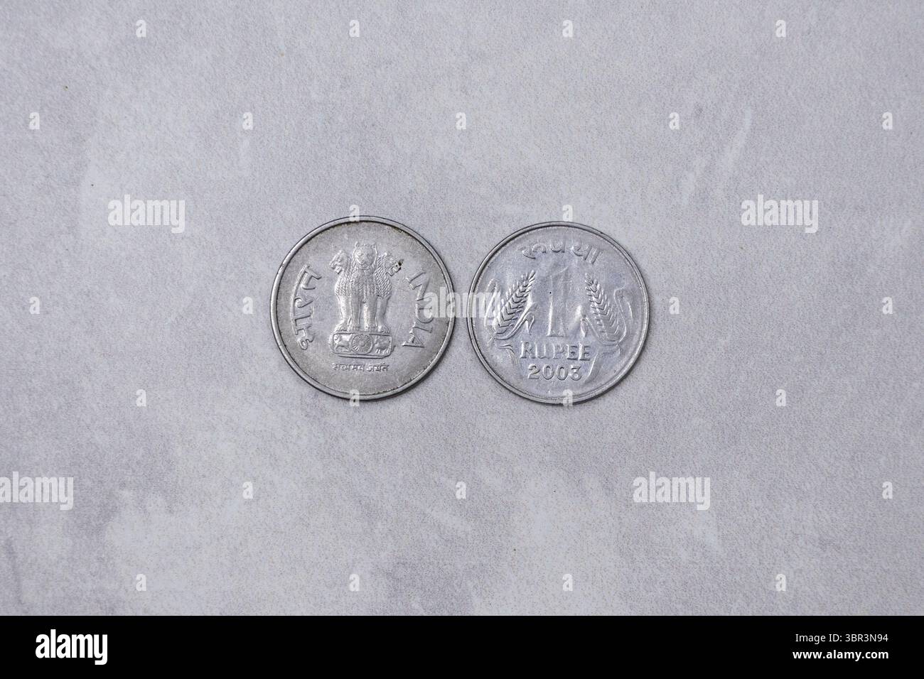 Indian one rupee old coin from 2003, showing both front and back sides ...