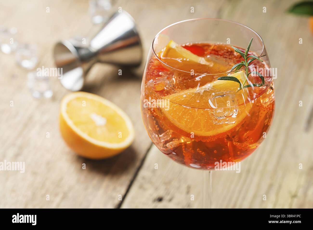 Classic Italian Aperol spritz cocktail in glass on wooden table Stock ...