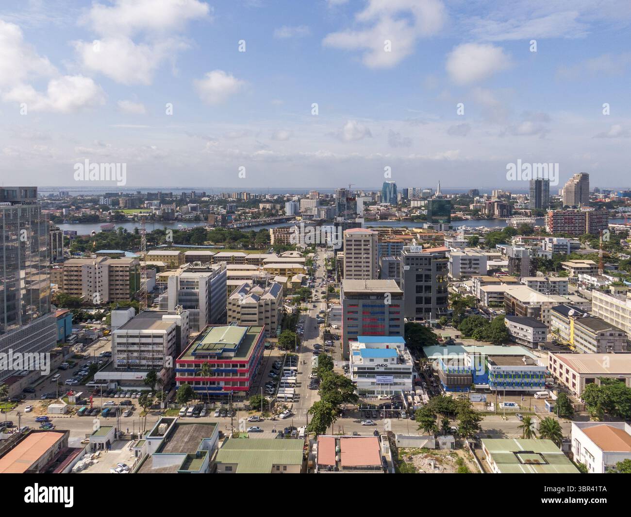 Aerial view of buildings and roads stretching towards the Lagos Lagoon ...