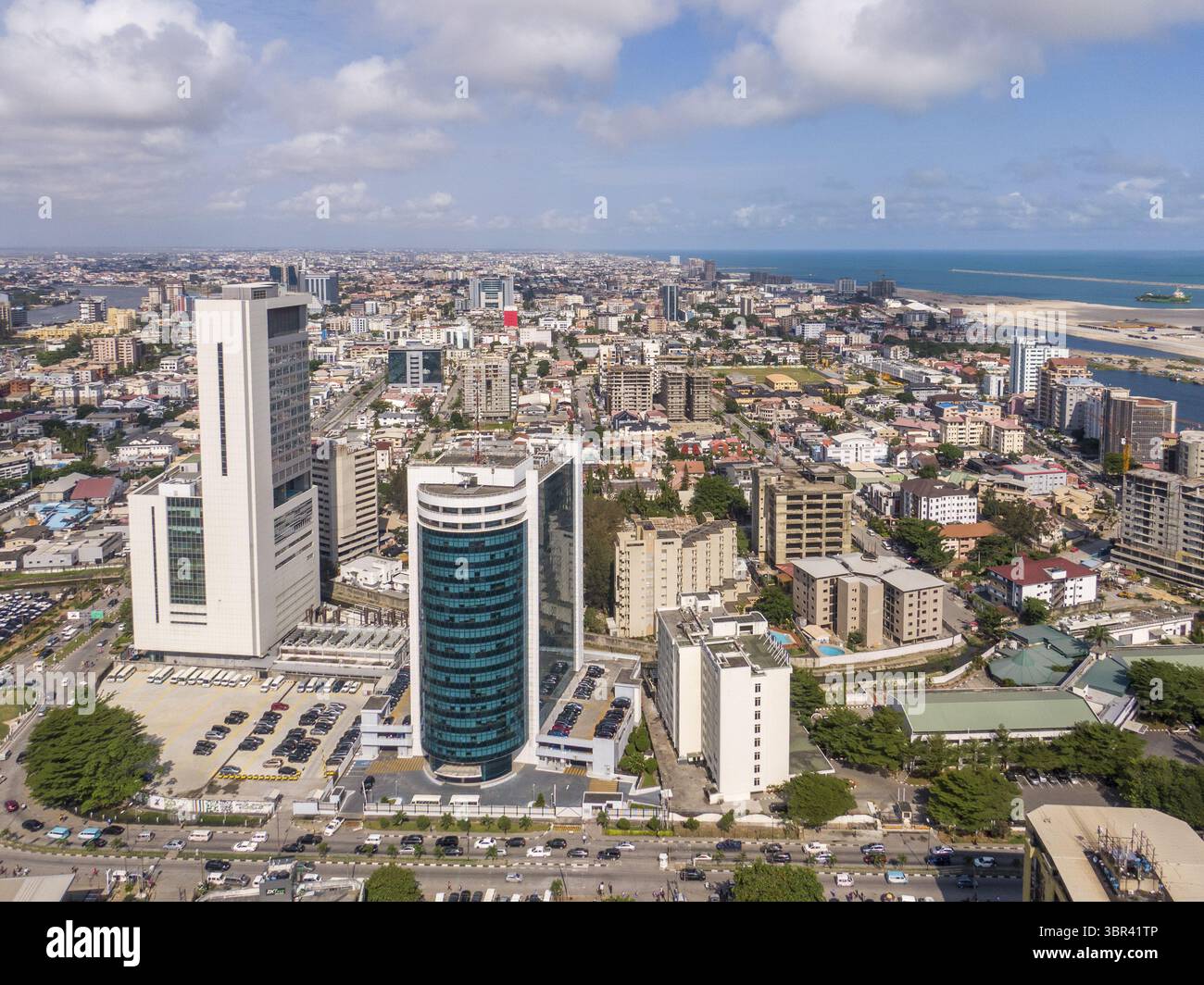Aerial view of gleaming skyscrapers and bustling streets meet the azure ...