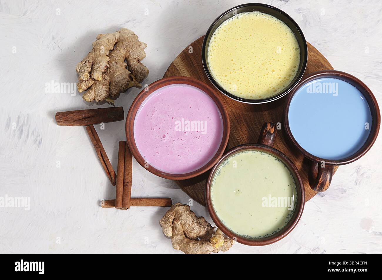 An assortment of colorful latte Japanese tea, golden turmeric, matcha ...