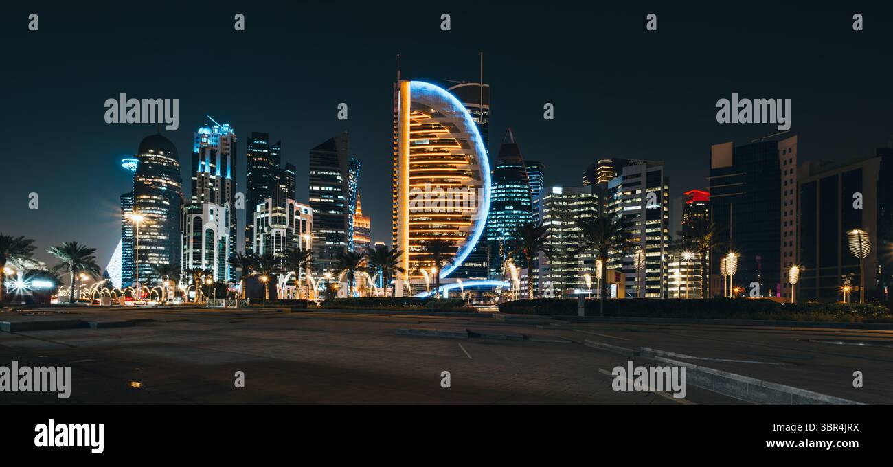 Tall modern skyscrapers tower over the central park in Doha Qatar ...