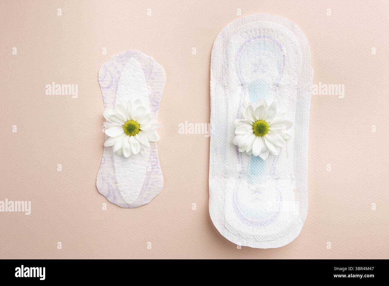 White sanitary pad with flowers on it, women's health or body positive ...