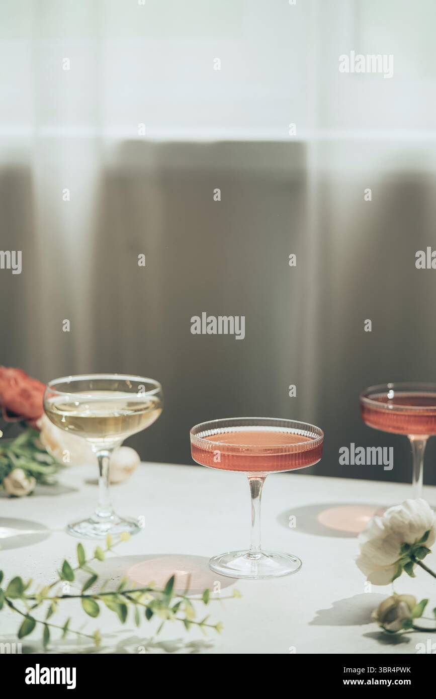 Sparkling wine or champagne glasses on white background with sharp ...
