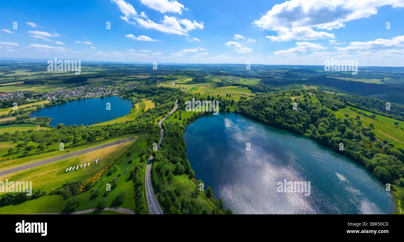 Aerial view of two lakes sparkling like sapphires under a vast sky ...
