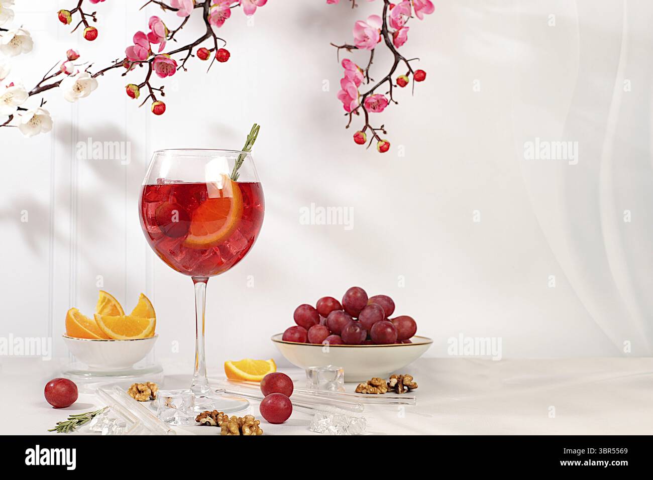 Royal lemonade cocktail with tequila, gin, rum, ice and grapes, bar and ...