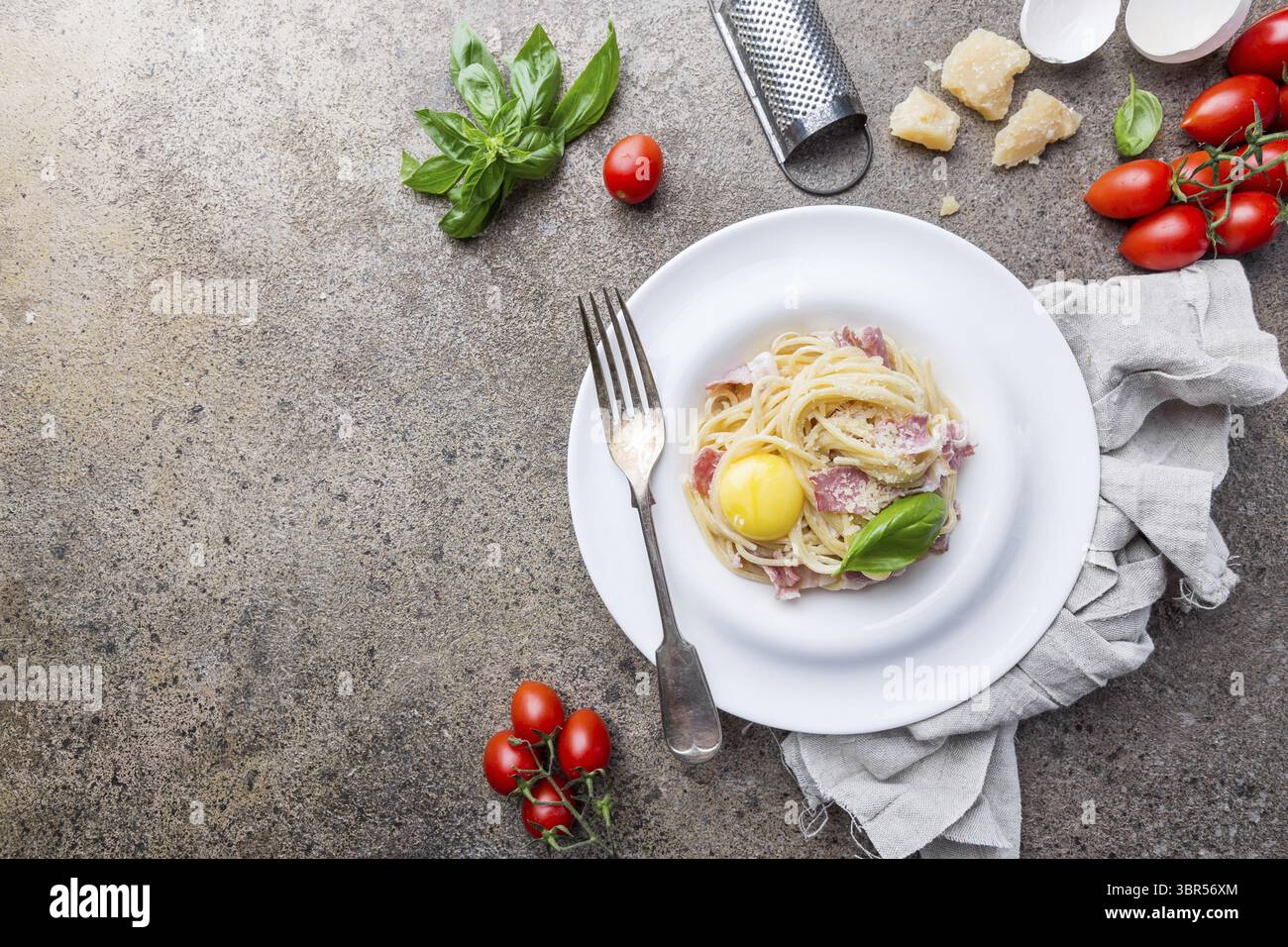 Classic Pasta Carbonara with yolk in a plate, top view Stock Photo - Alamy